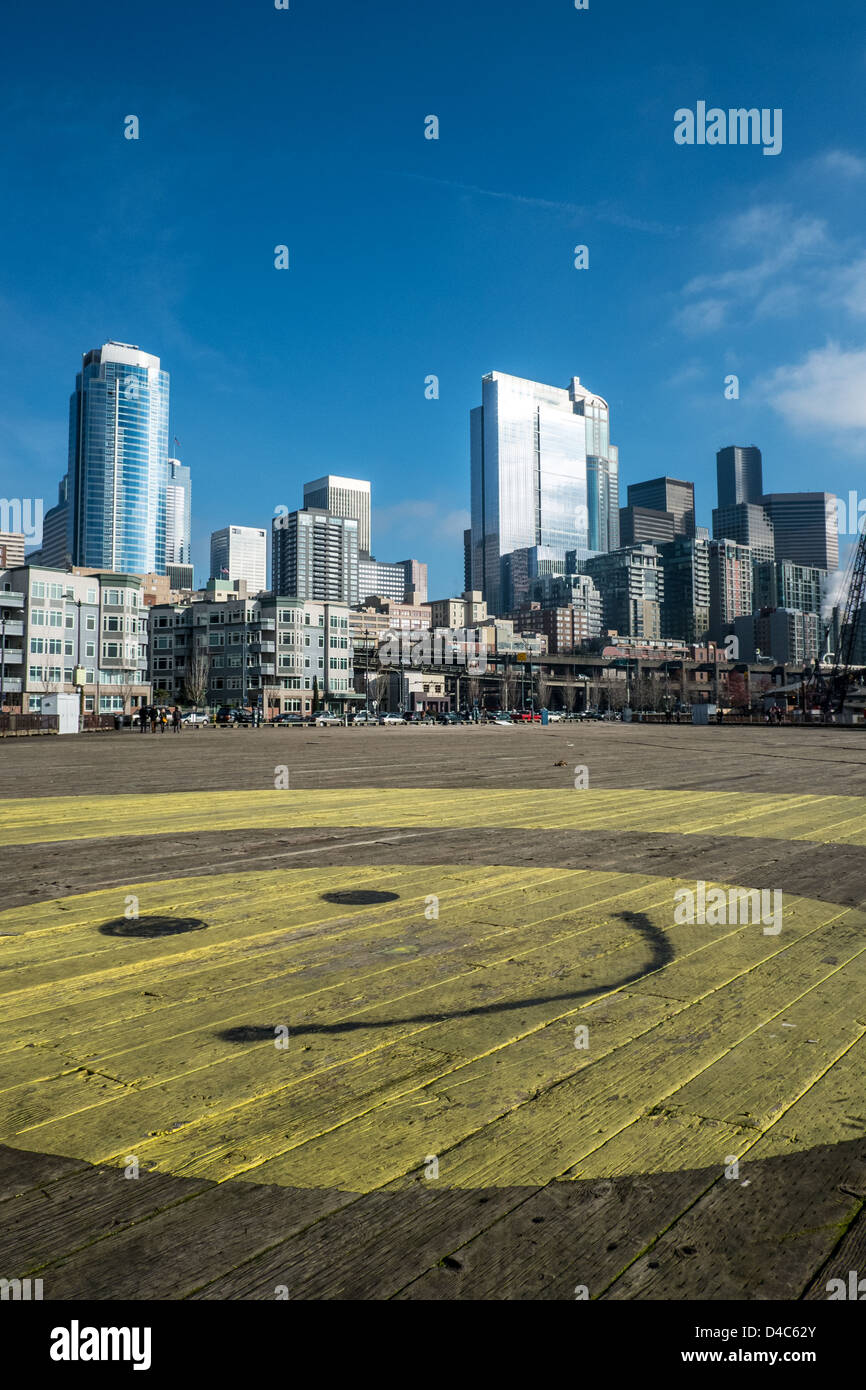 A big smiley face painted on a walk board by the Seattle water front ...