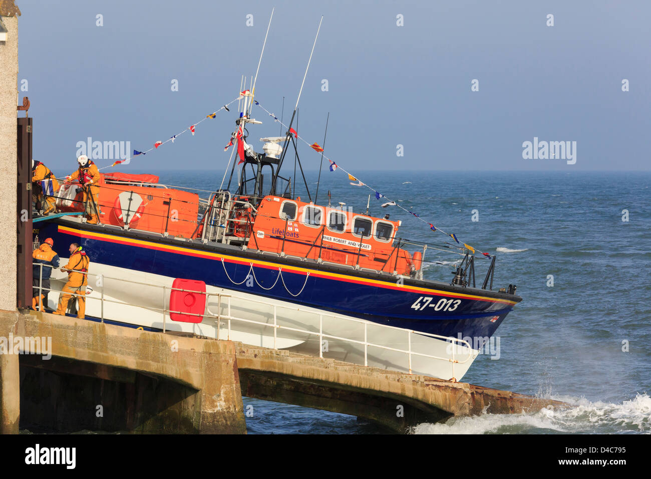 RNLI Tyne class lifeboat with some of crew members preparing to launch ...
