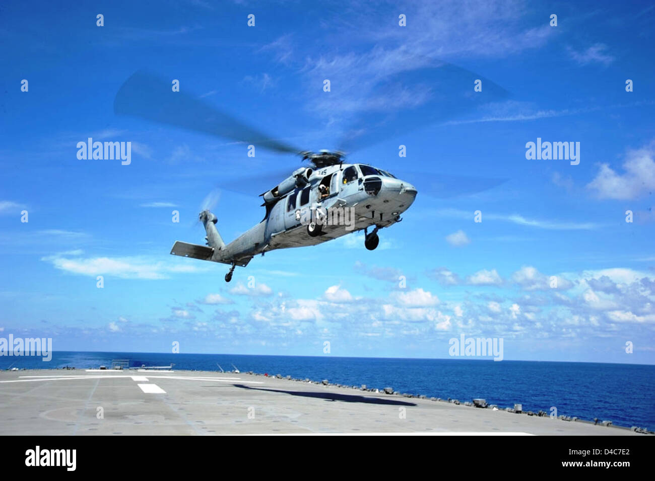 USNS Mercy Crew Member Takes Photo of Helicopter Stock Photo - Alamy