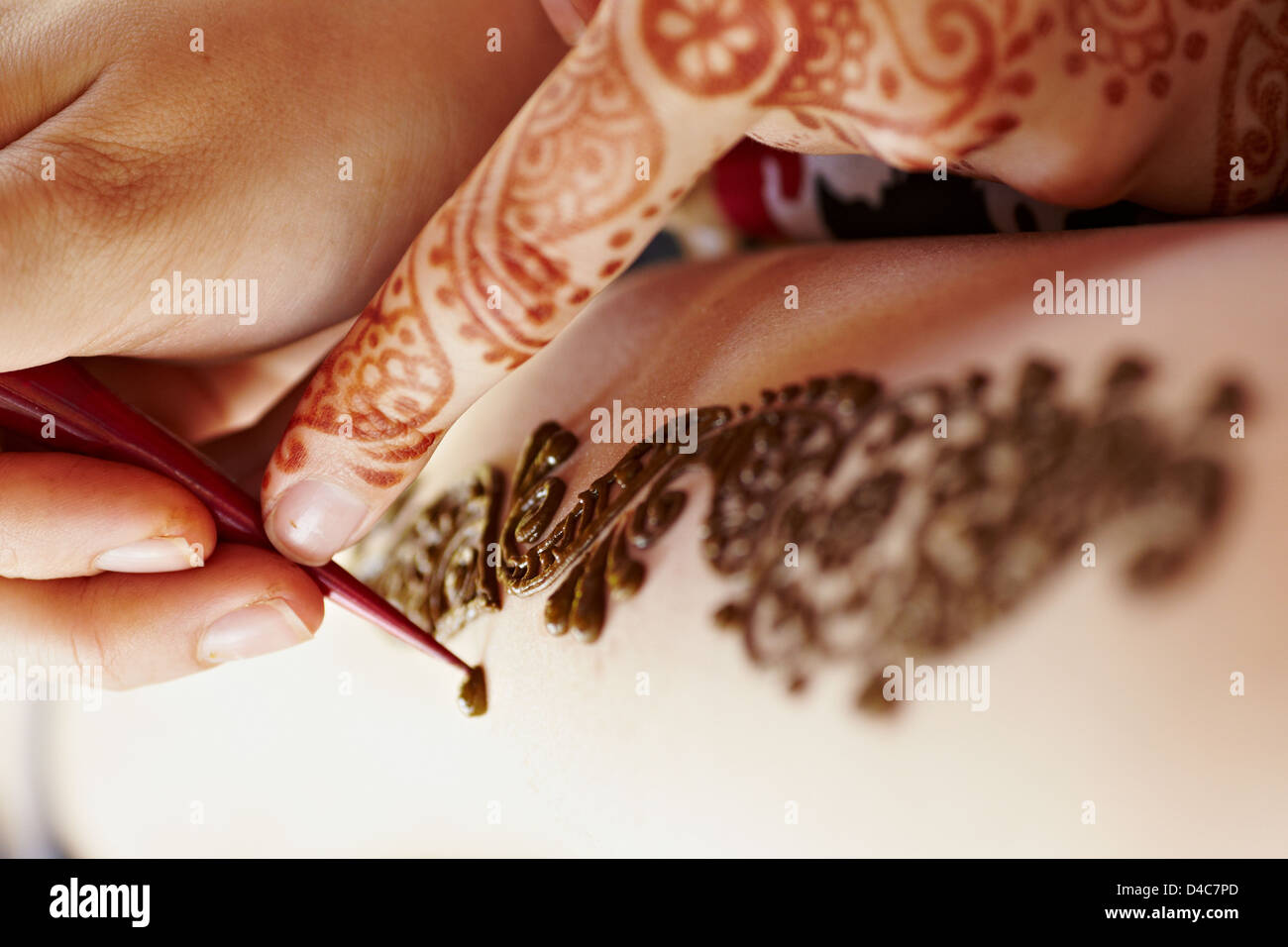 Henna art on woman's hand Stock Photo - Alamy
