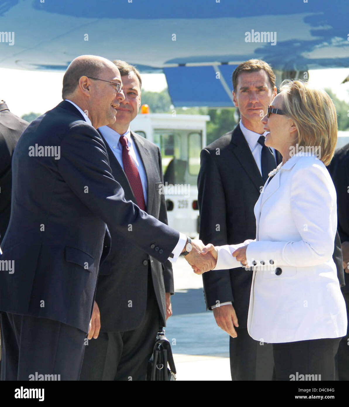 Secretary Clinton Is Greeted By Consul General of the American ...