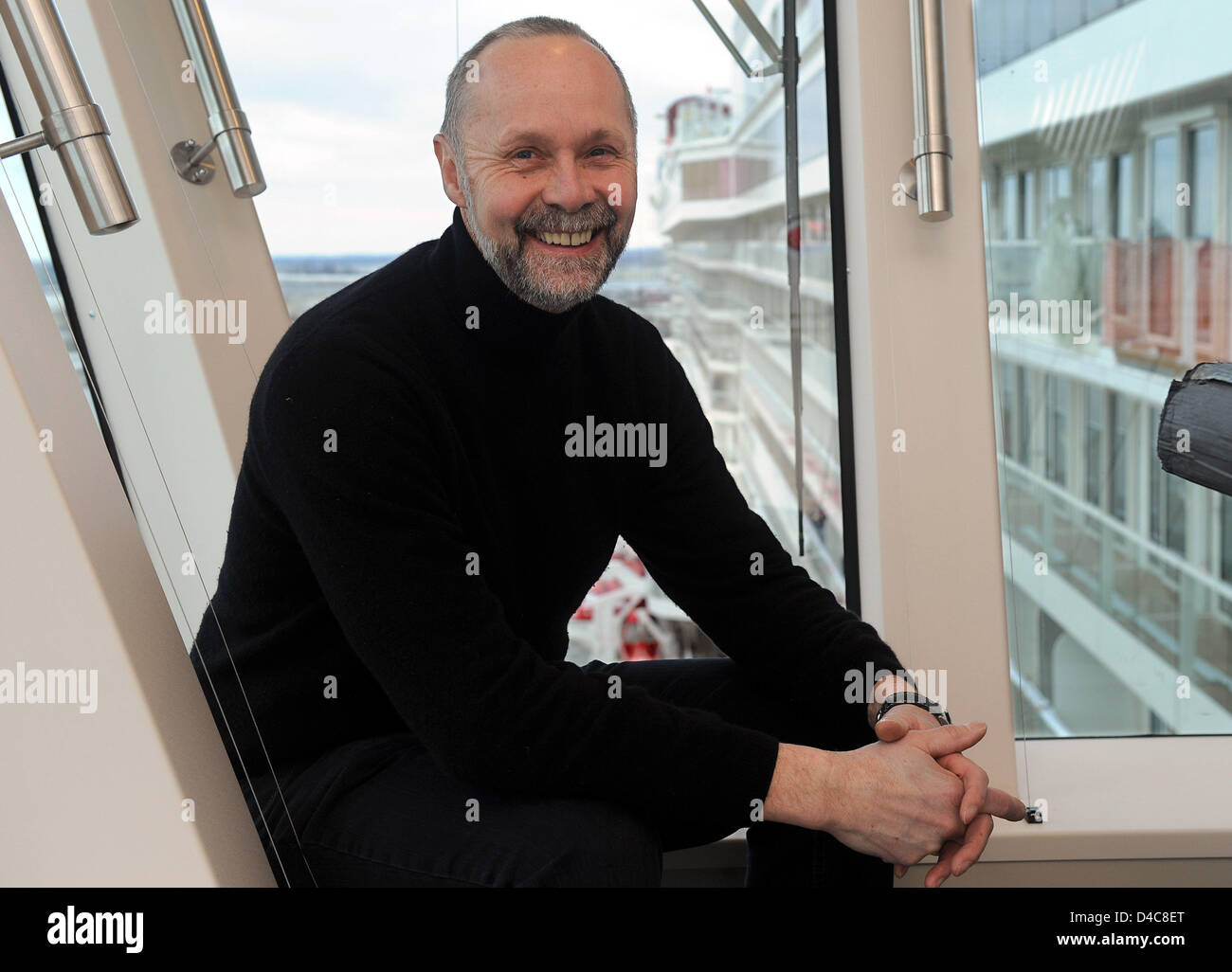 Shipyard captain Thomas Teitge sits on the starboard bridge wing of the ...