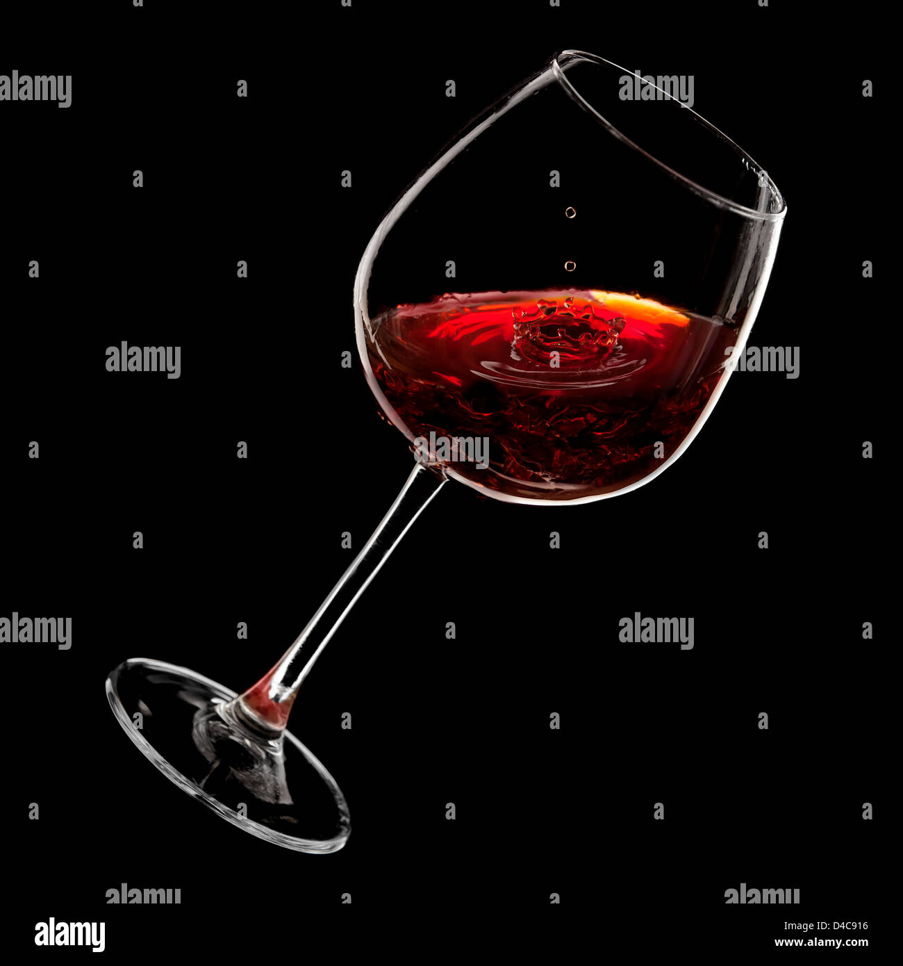 drops of red wine dripping into a glass Stock Photo - Alamy