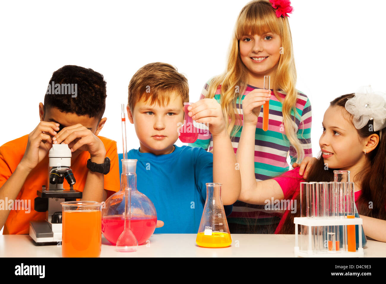 Four kids in school lab Stock Photo - Alamy