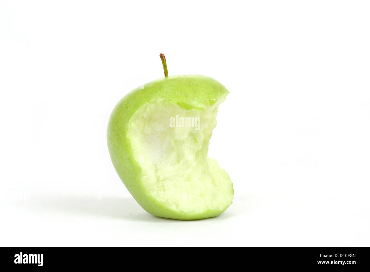 Green bitten apple isolated on white background Stock Photo - Alamy