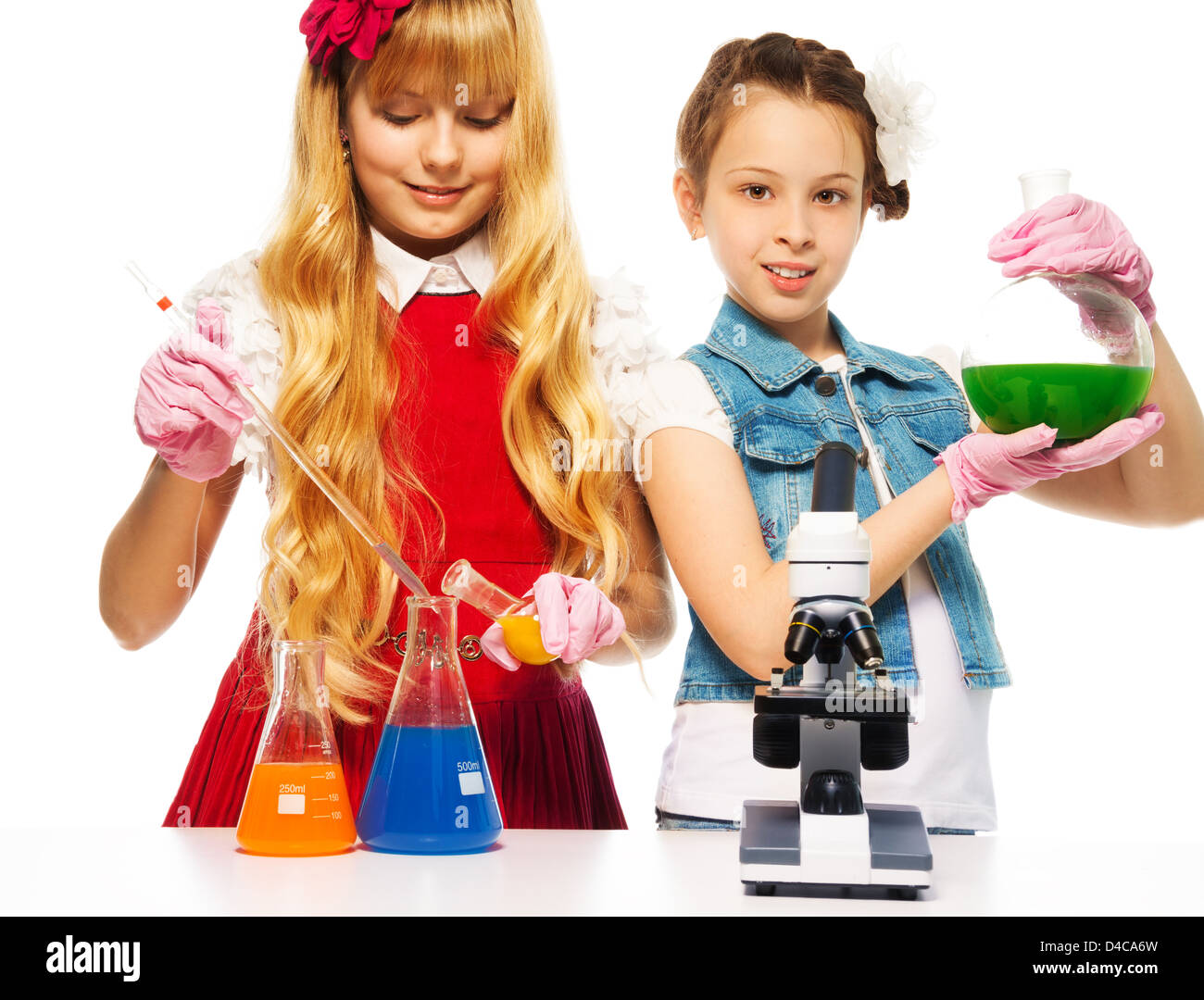 Two girls and chemistry lab equipment - flask and microscope Stock ...