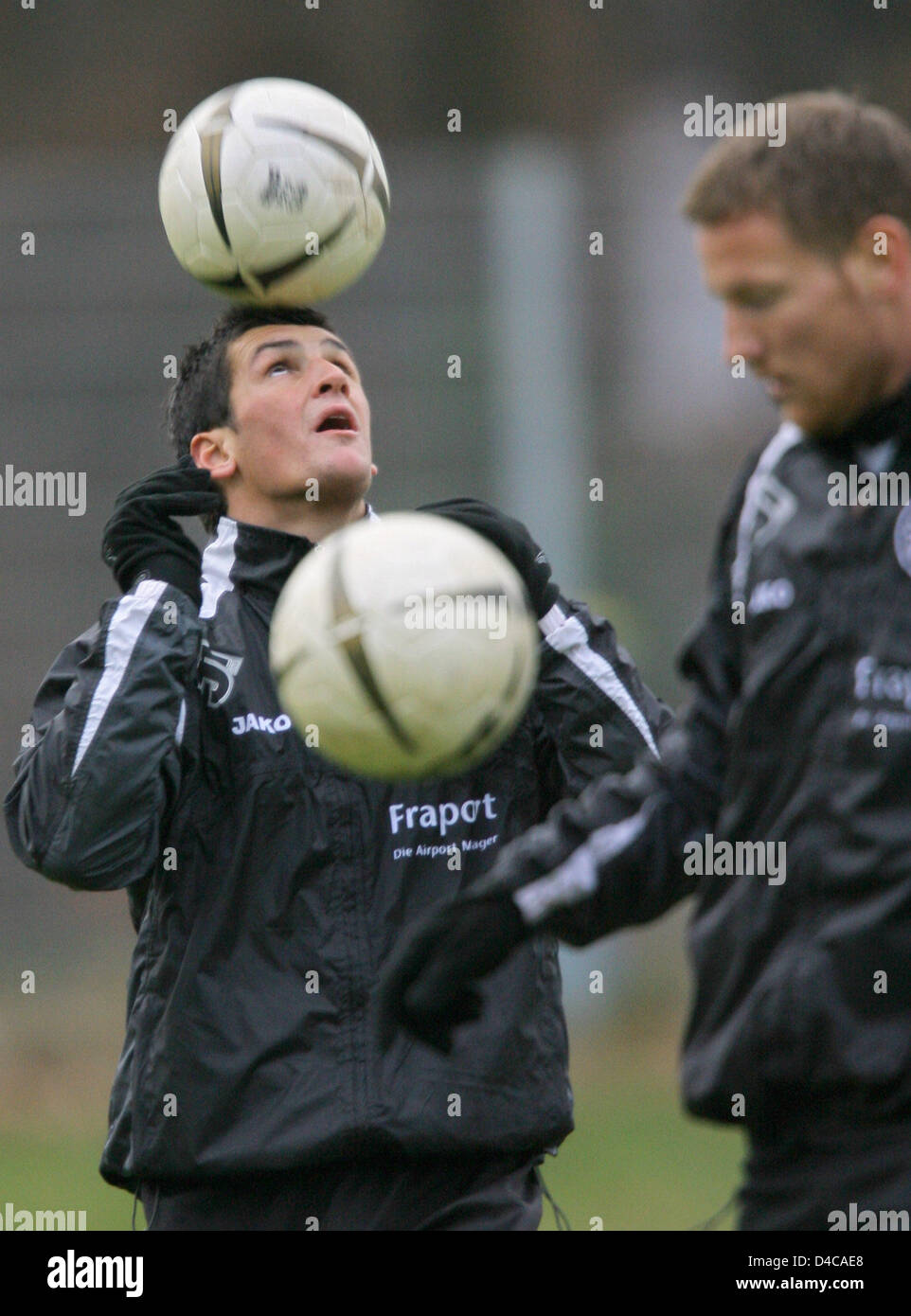 Eintracht Frankfurt's new signing Czech Martin Fenin (R) juggels the ...