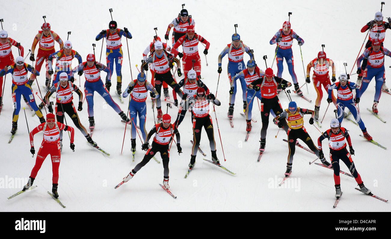 Thirty female biathletes are pictured just after the start of the 12.5 ...