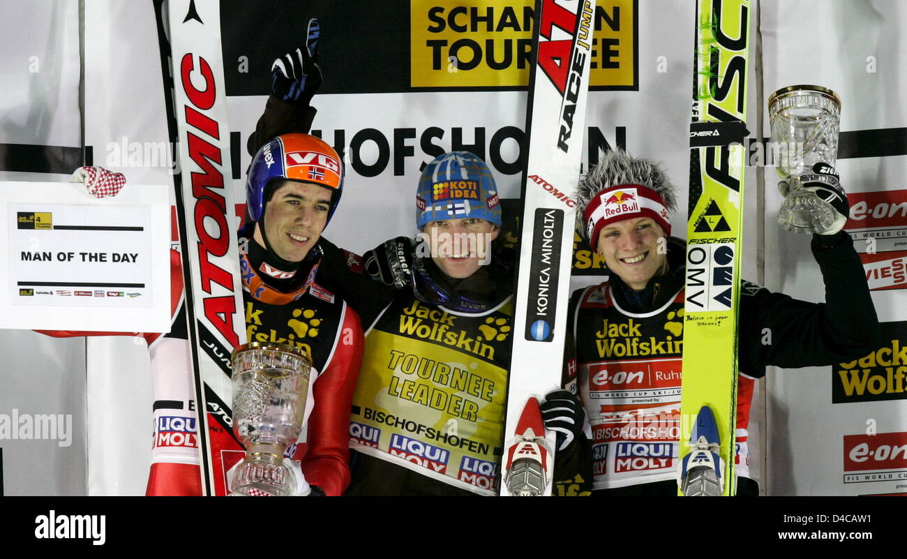 The Finnish winner Janne Ahonen (C) cheers on the podium with Norwegian ...