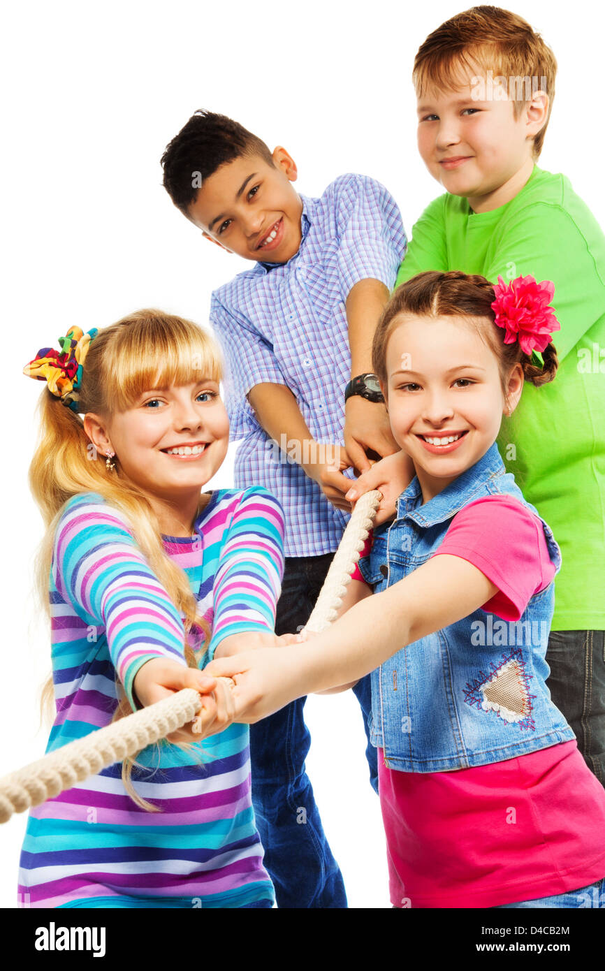 Close-up of group of five diversity looking kids pulling the rope ...