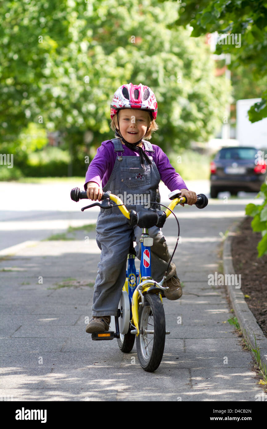 Happy toddler on a bike Stock Photo - Alamy