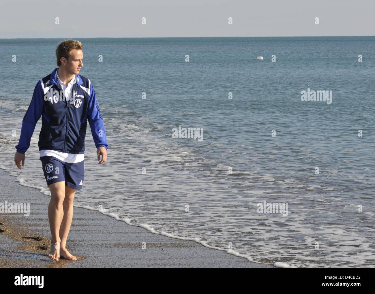 Ivan Rakitic of Bundesliga club FC Schalke 04 walks along the beach in ...