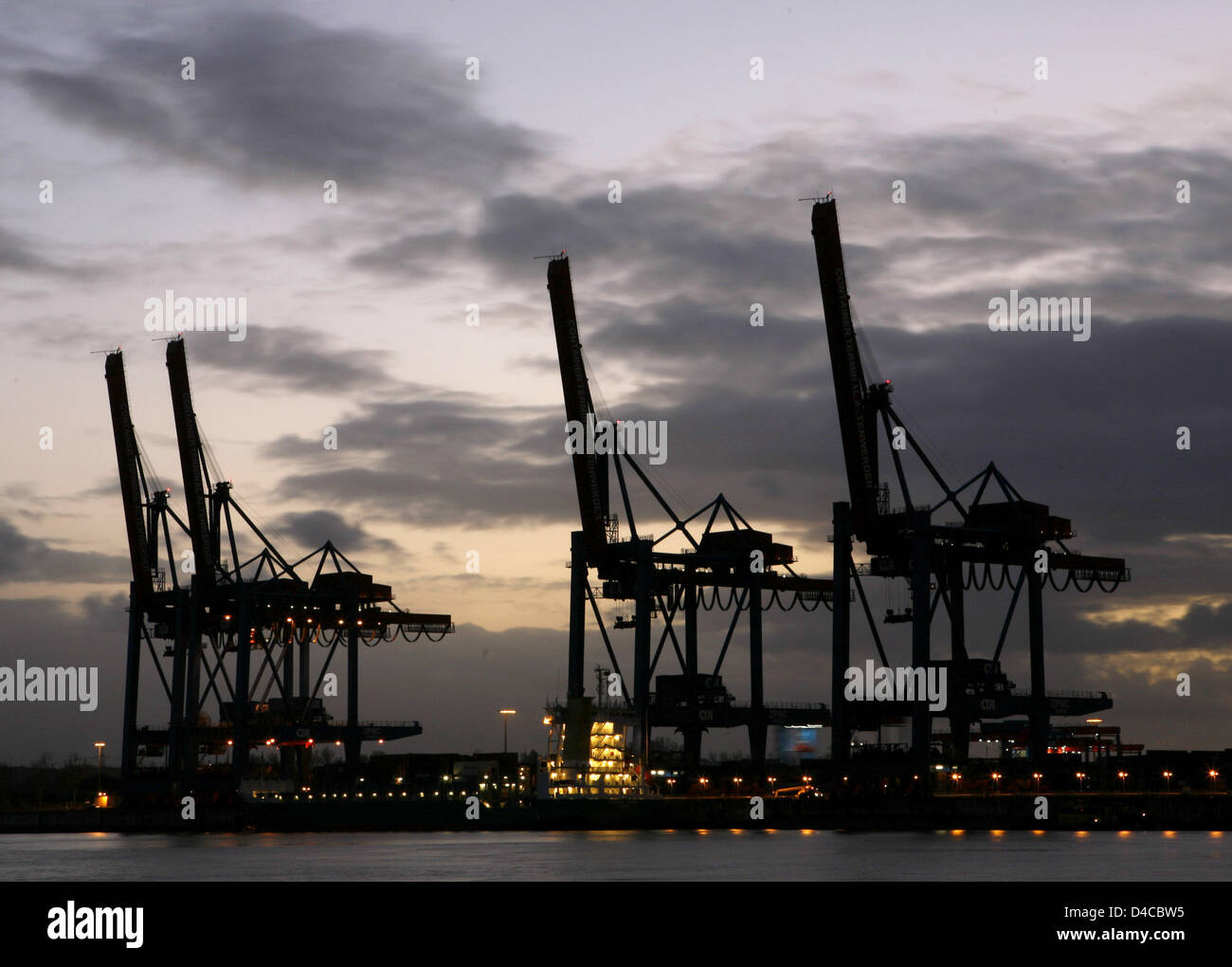 Several cranes discharge shipments of container ships in the port of ...