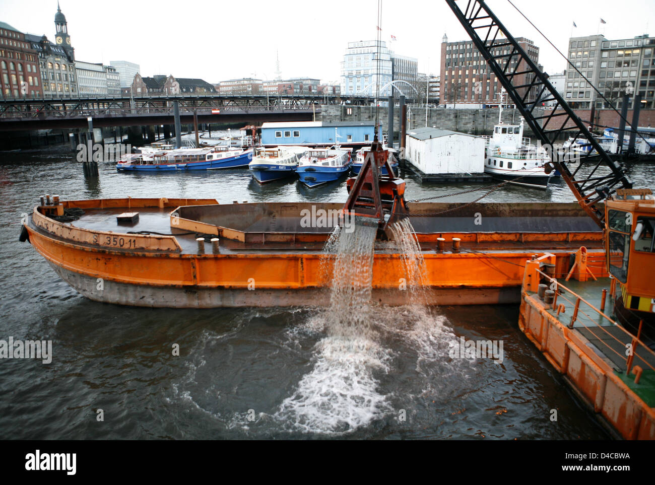 A digger boat is pictured in the Speicherstadt, the old storage ...