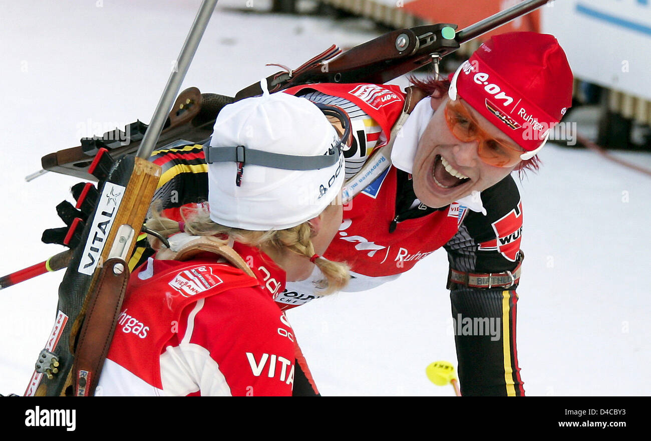 German Kati Wilhelm (R) and Norwegian Solveig Rogstad celebrate after the women's 10 km pursuit ...
