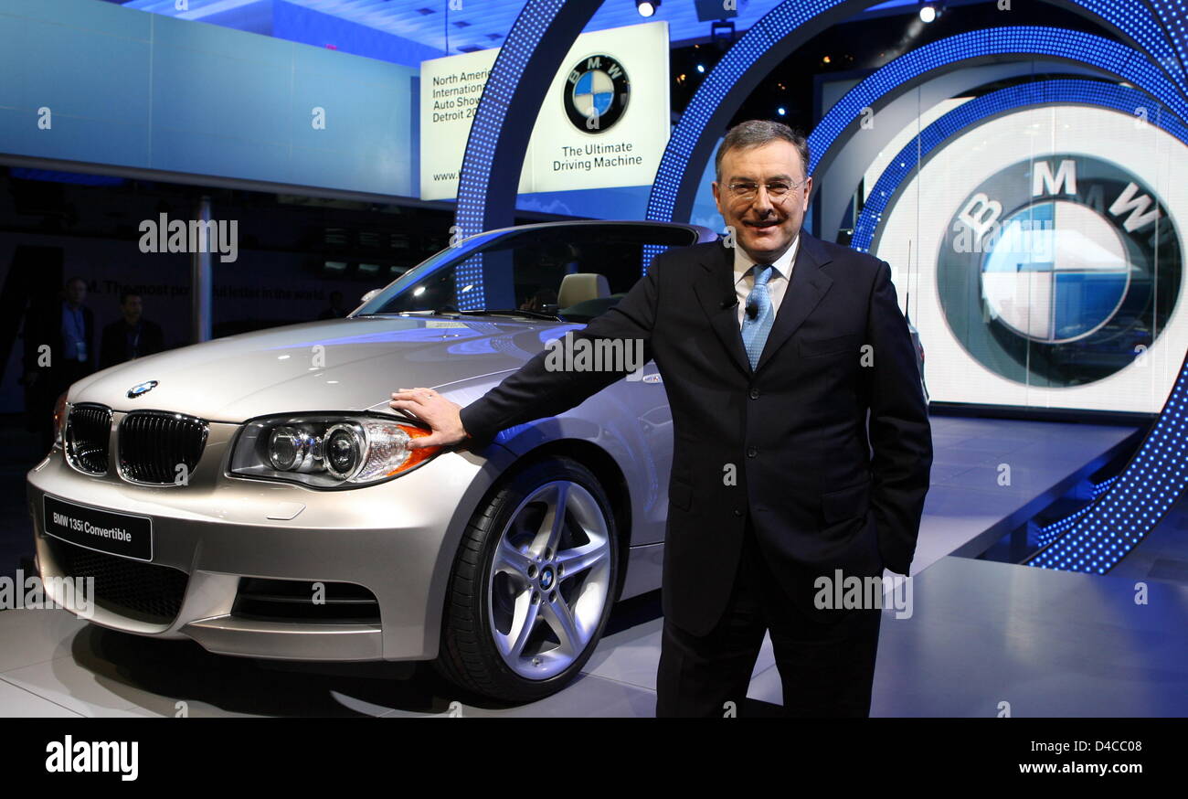 Norbert Reithofer, CEO of BMW, poses in front of a BMW 135i Convertible ...