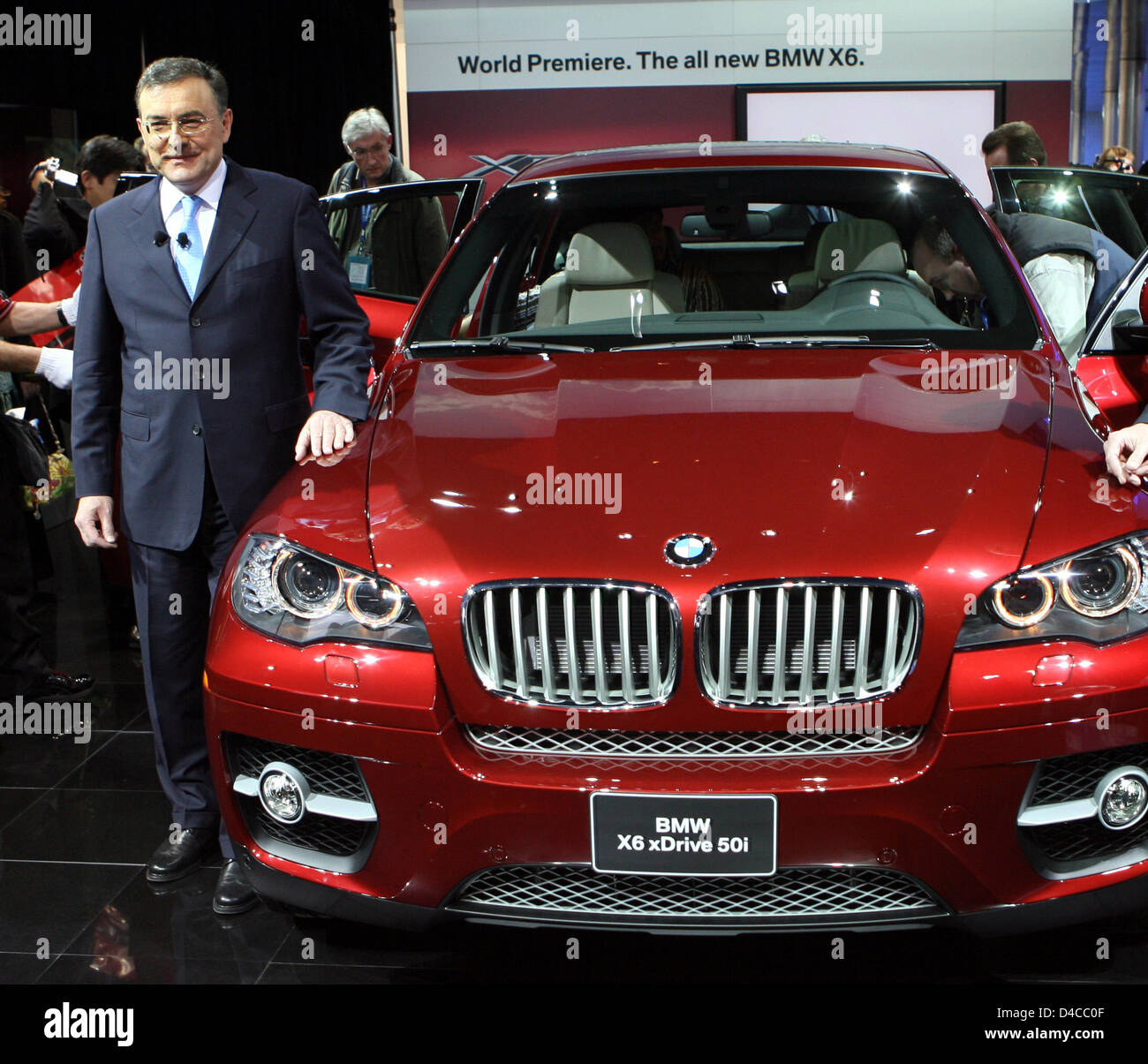 Norbert Reithofer, CEO of BMW, poses in front of a new BMW X6 during ...