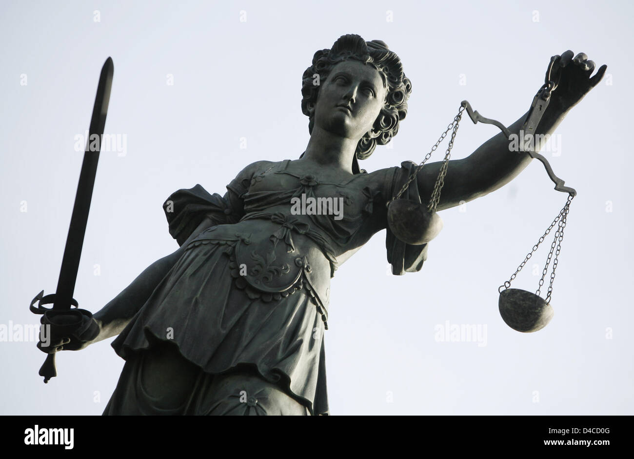The picture shows a statue of the Roman goddess of justice on the ...