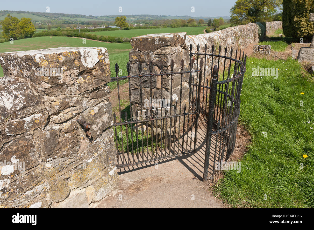 wrought iron kissing gate and kent ragstone wall leading out towards ...