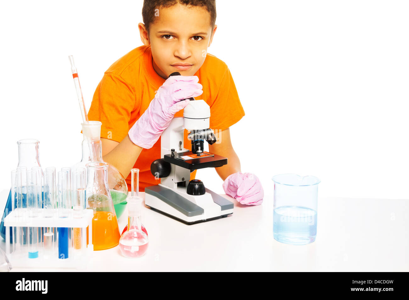 Happy black boy with short hair in chemistry lab class with microscope ...