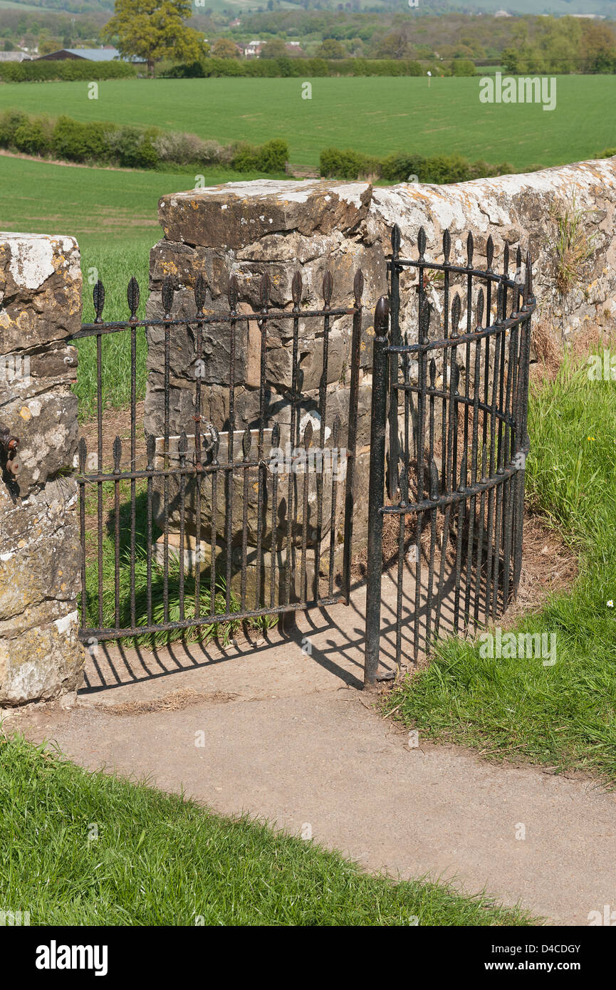 wrought iron kissing gate and kent ragstone wall leading out towards ...
