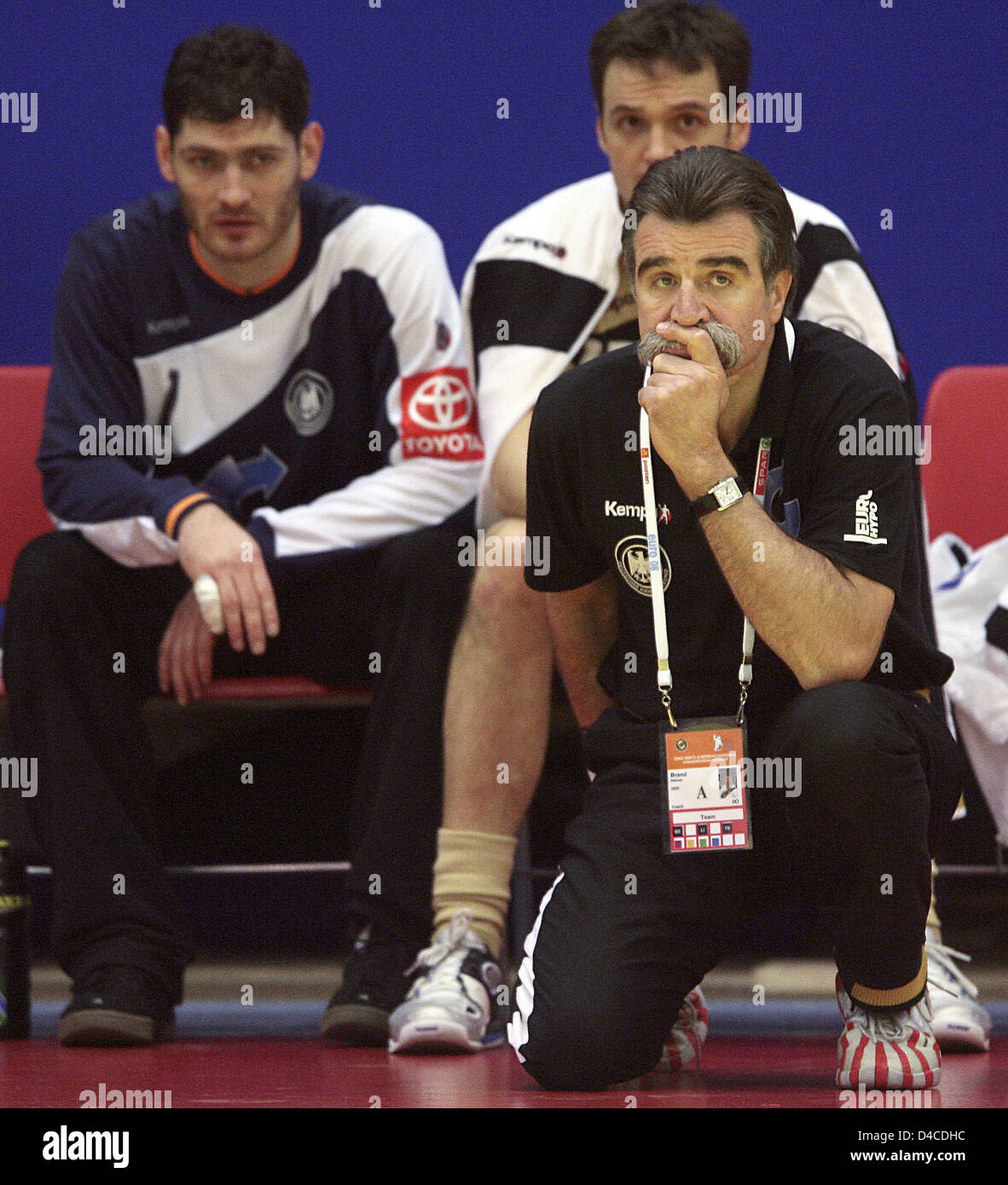 Germany's head coach Heiner Brand (R-L), player Markus Baur and ...