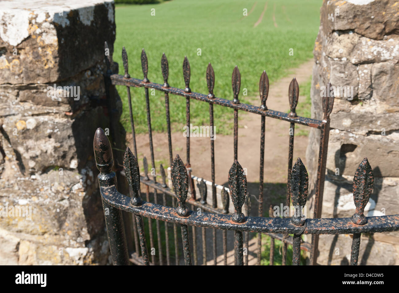 wrought iron kissing gate and kent ragstone wall leading out towards ...