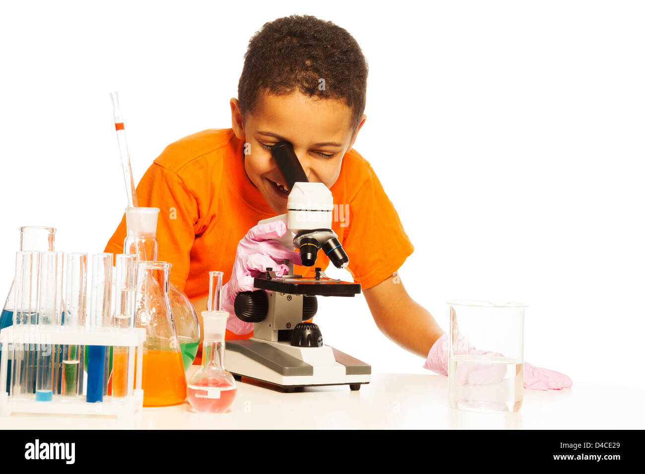 Serious 8 years old black boy with short hair in chemistry lab class ...