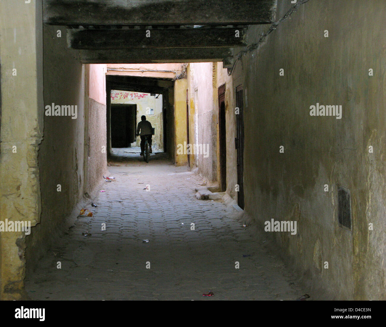 A man cycles through an alleyway in Meknes, Morocco, 14 December 2007 ...