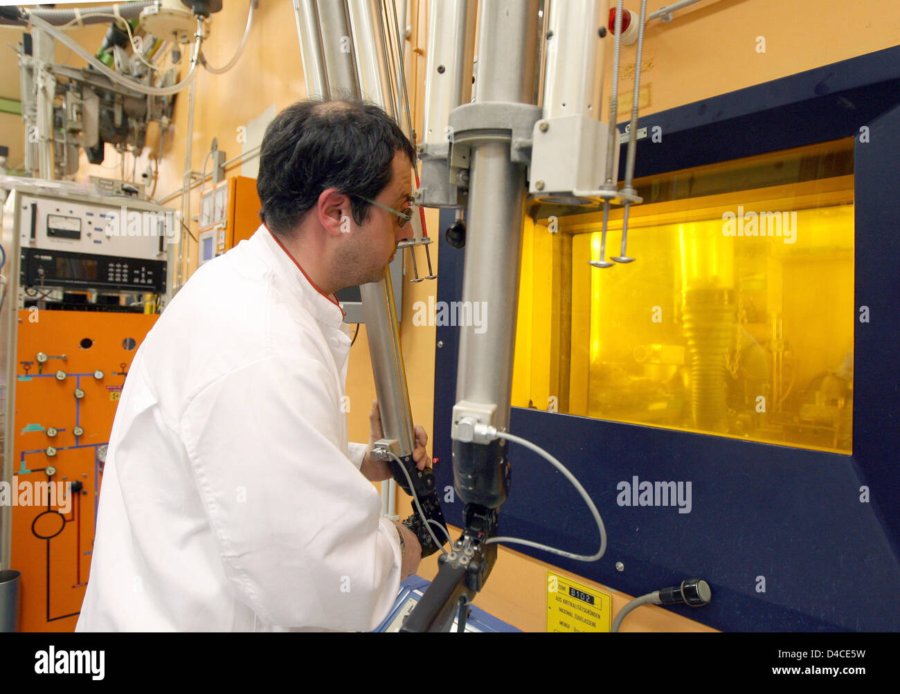 A scientist operates a room with so-called 'hot cells' to analyse ...
