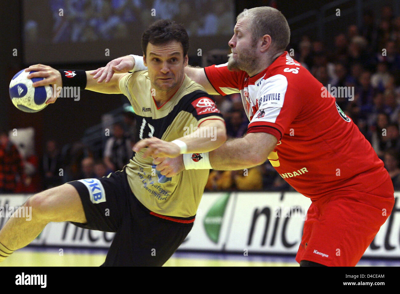 Markus Baur of Germany (L) is challenged by Iceland's ASigfus ...