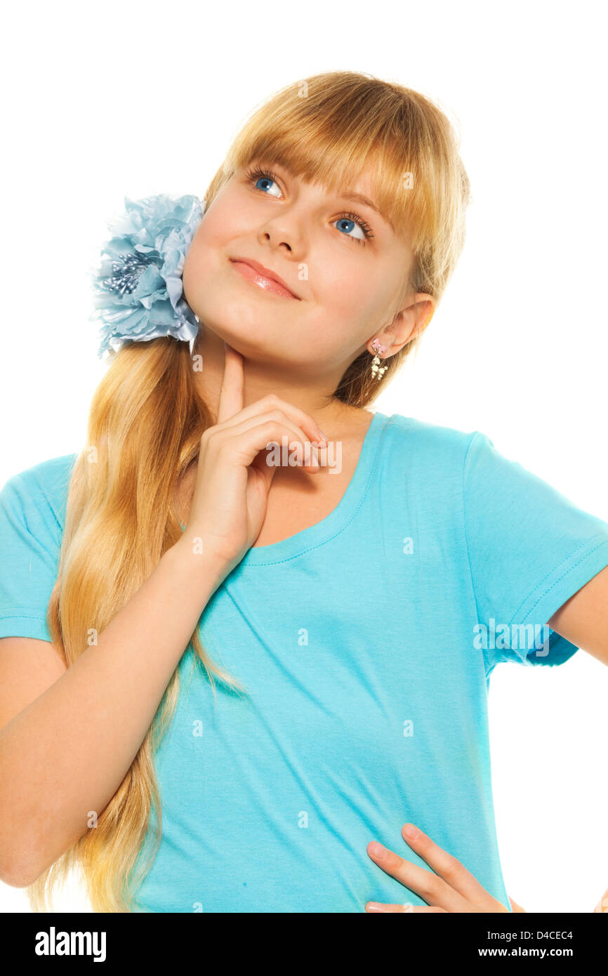 Thoughtful girl with mild smile showing thinking gesture with her fnger ...