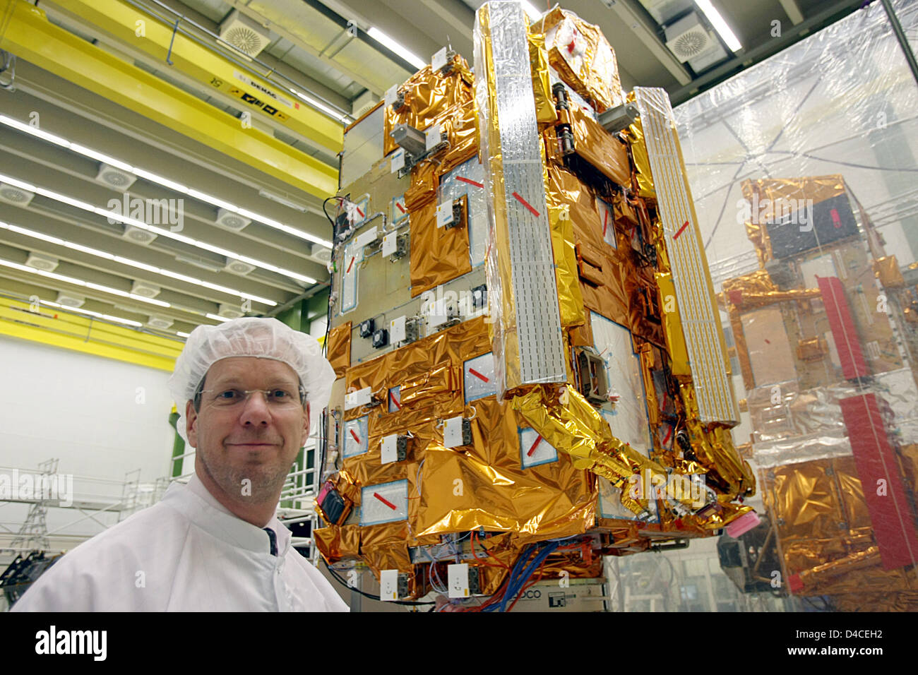Evert Dudok, CEO of Astrium Satellites, is pictured next to the ...