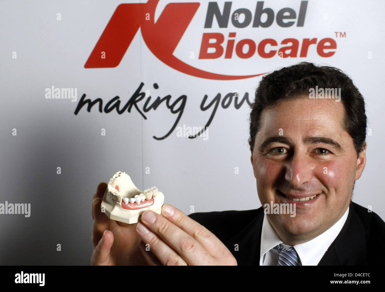 Domenico Scala, CEO of dental implants producer Nobel Biocare, shows ...