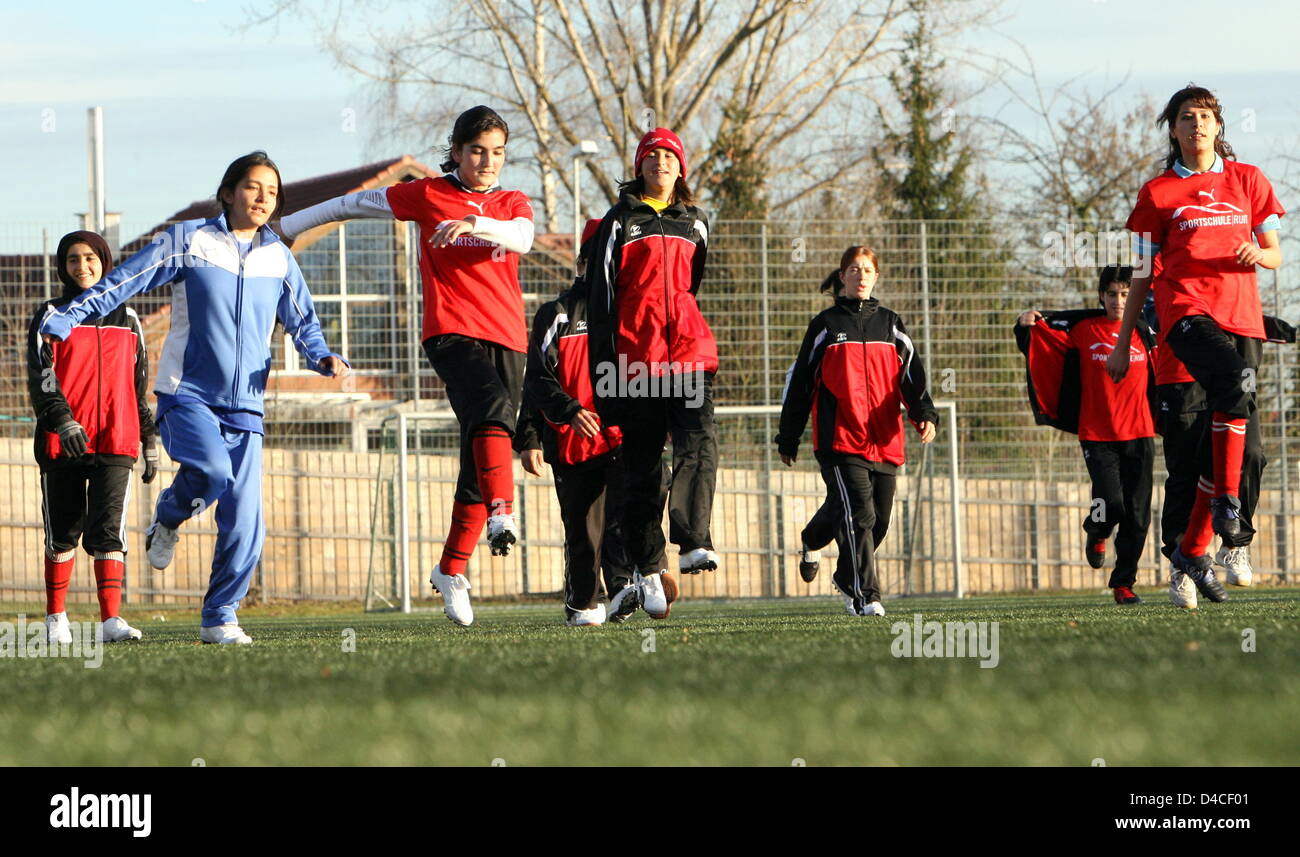 Players of the national Afghan women's soccer team exercise at the ...