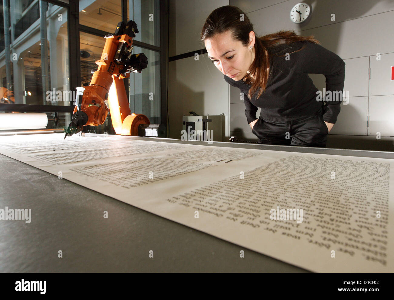 The 'bios [bible]' roboter writes the Luther bible in calligraphy at ...