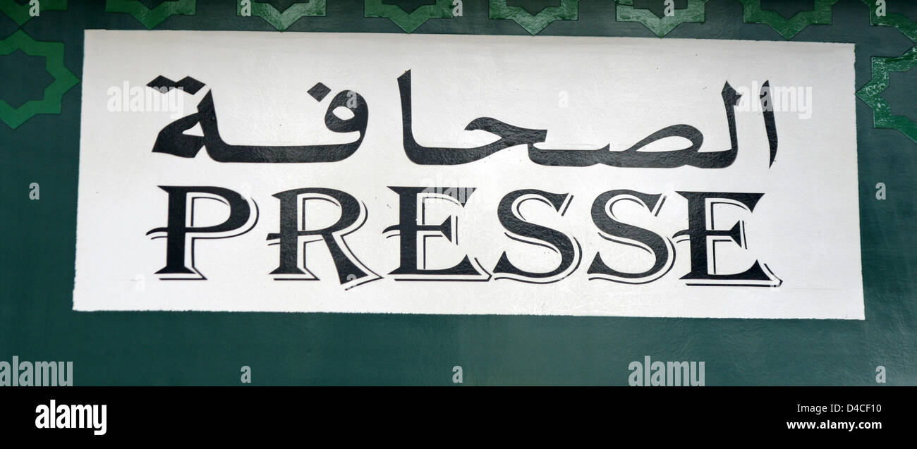 The picture shows a sign reading Press in Latin and Arabic letters in ...