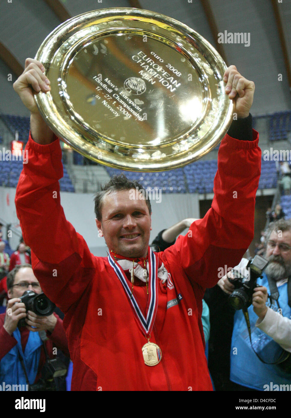 Denmark's Lars Christiansen cheers with the trophy after the victory in ...