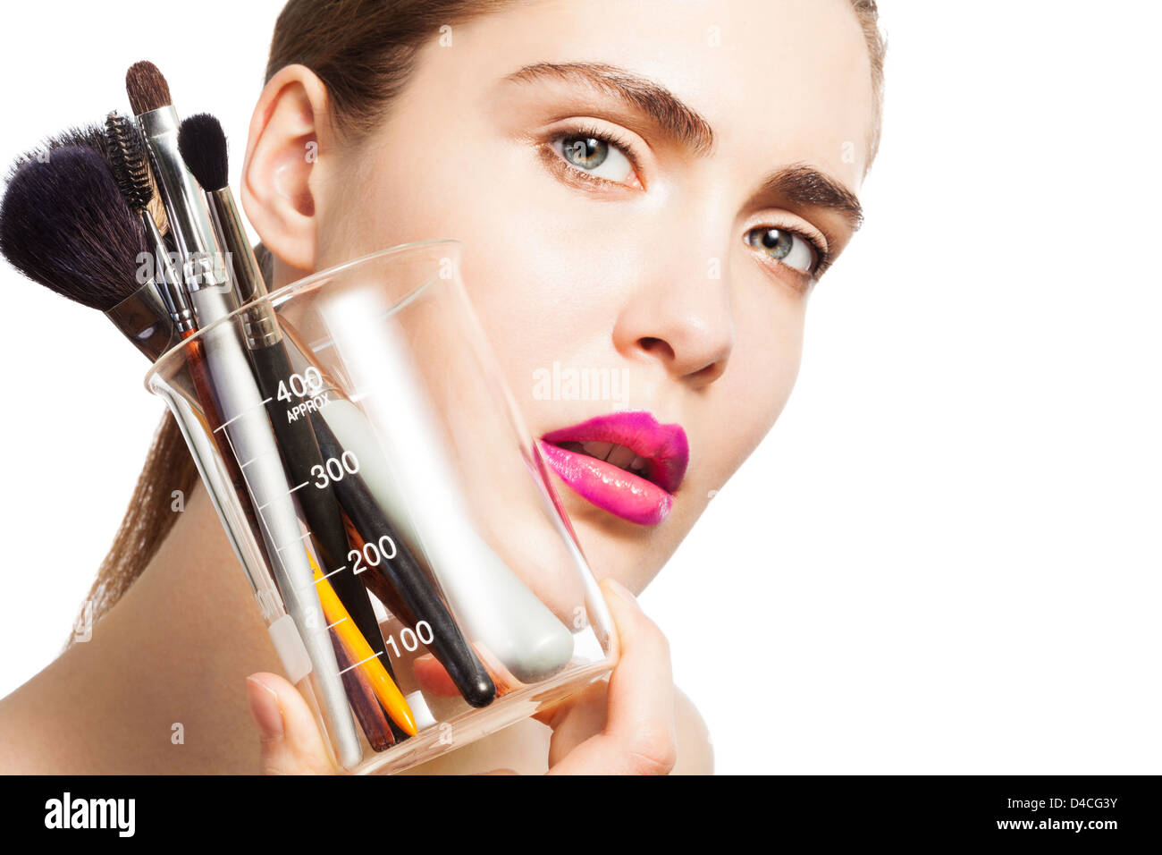 Beauty portrait of attractive woman holding lab glass with makeup ...