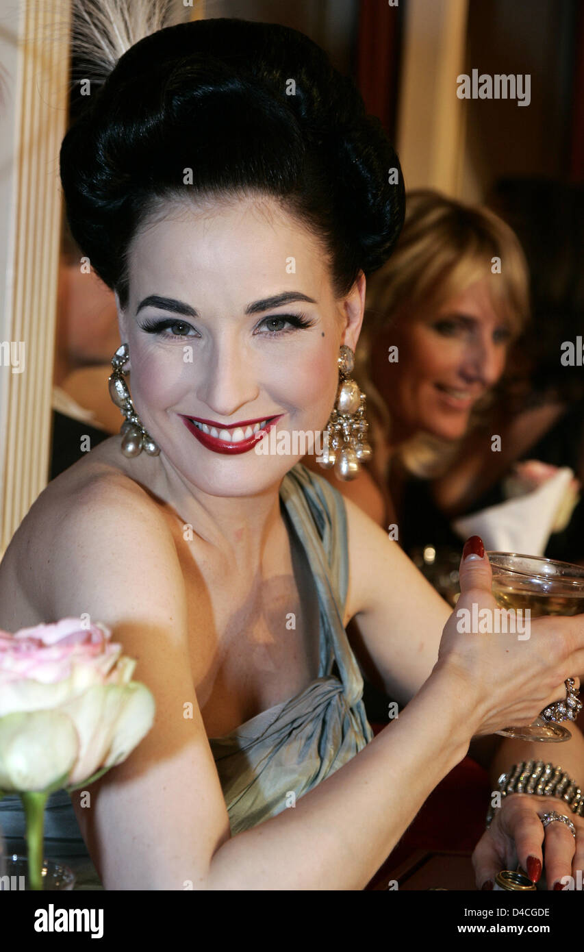 US-actress and model Dita von Teese smiles and drinks in her loge at ...