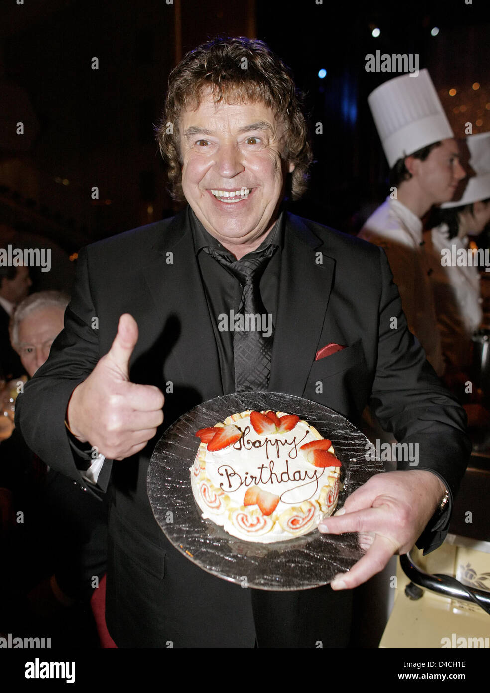 Pop singer Tony Marshall poses with his birthday cake at the Kurhaus in ...