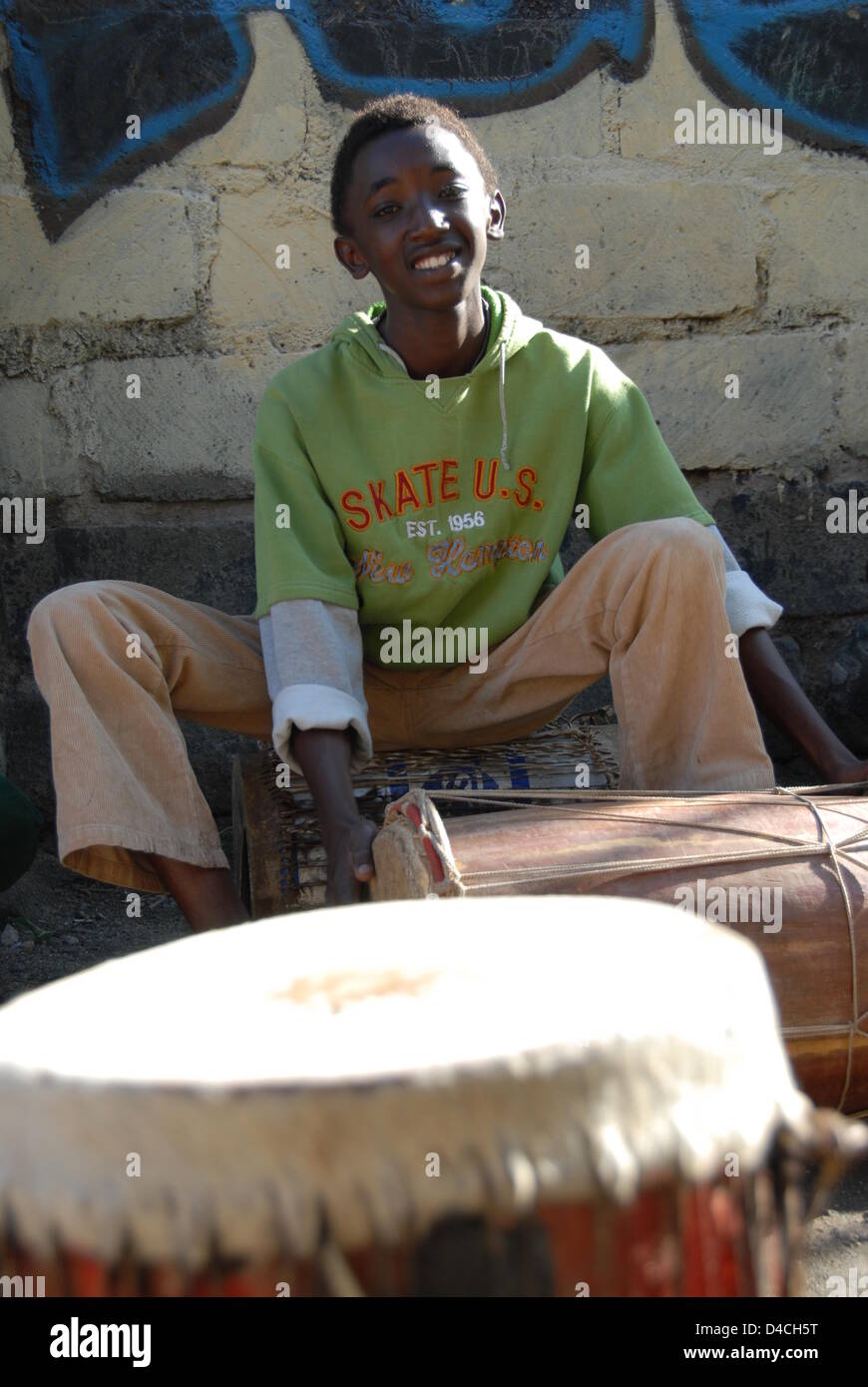 A boy beats the drums in a youth project of the Mathare Youth Sports ...
