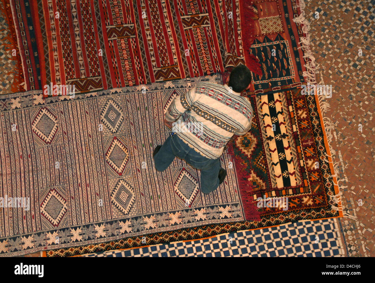 A carpet vendor pictured in Fes, Morocco, 15 December 2007. Photo: Lars ...