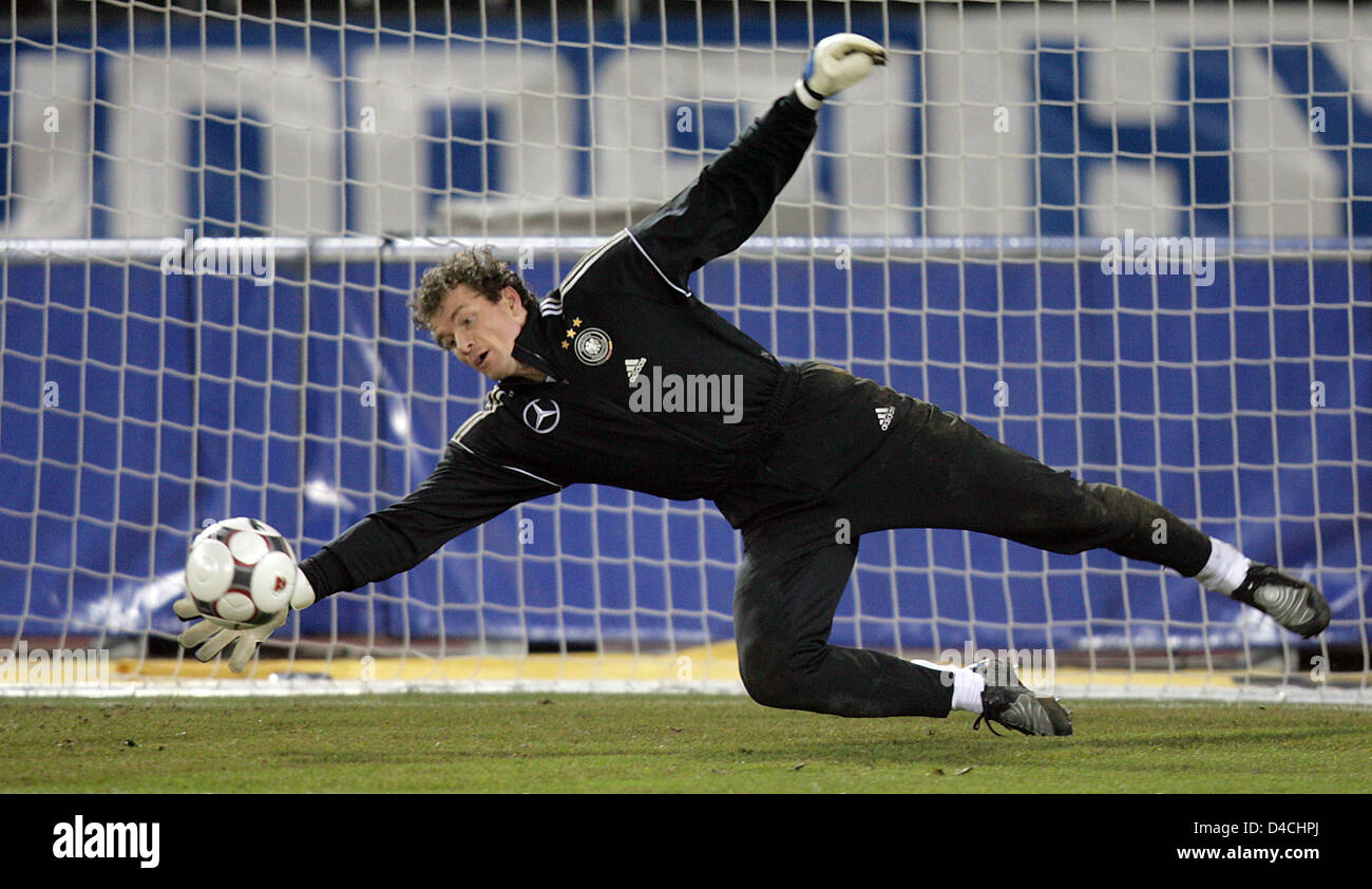 Germany's goal keeper stretches to reach the ball during his team's ...
