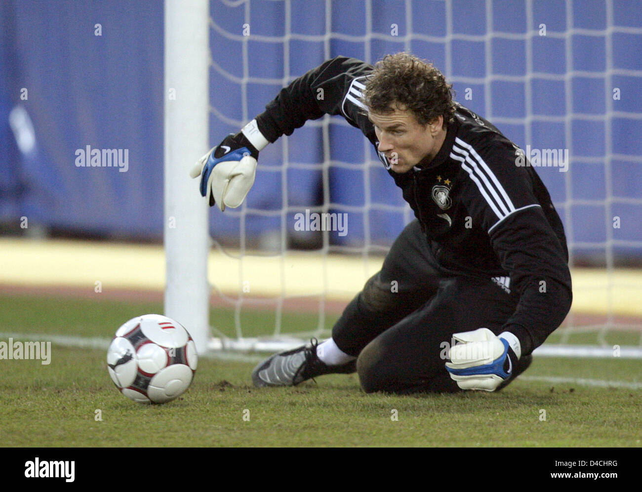 Germany's goal keeper Jens Lehmann catches a ball during his team's ...