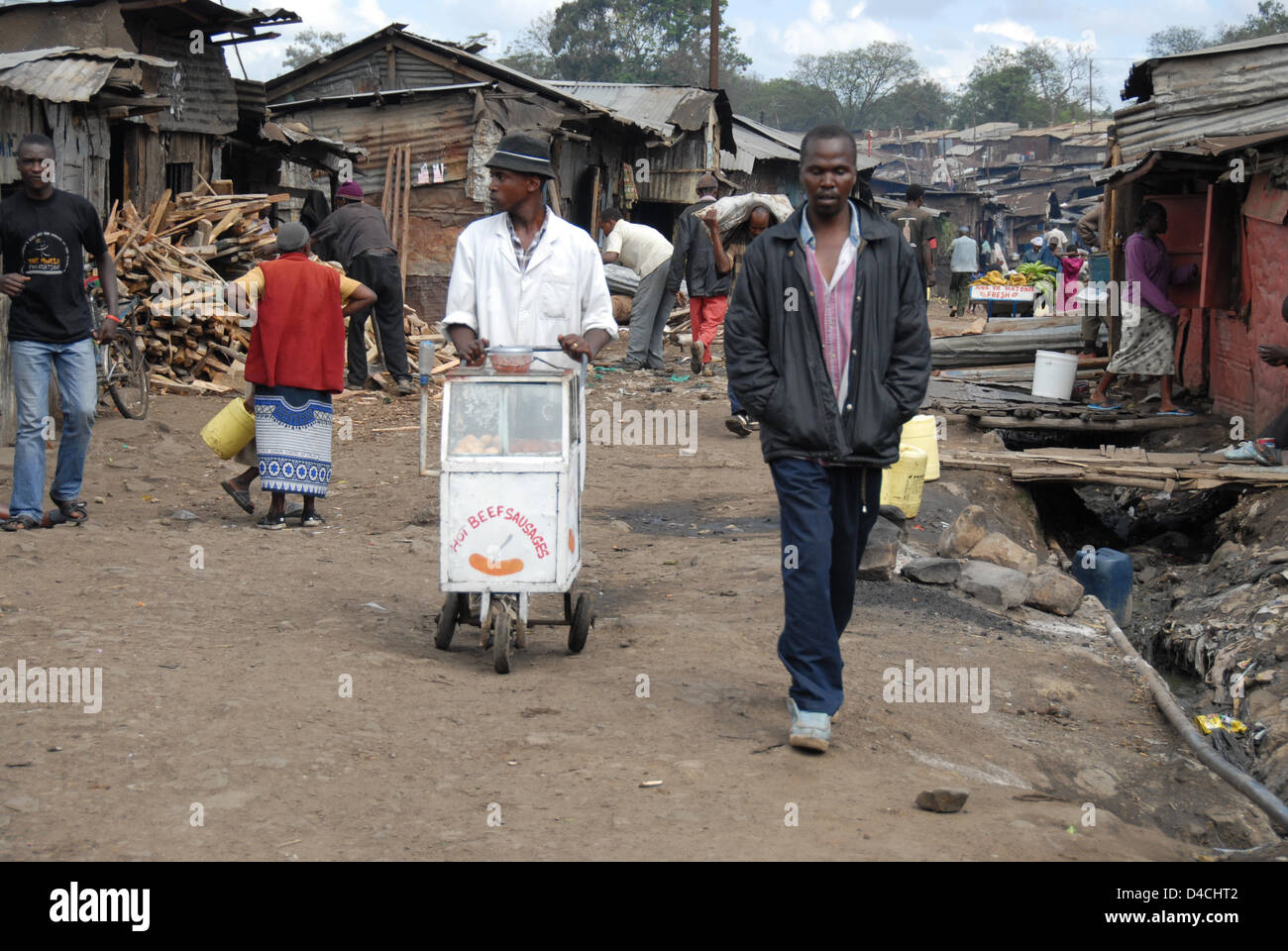 The picture shows a daily life scene in the streets of the Mathare ...