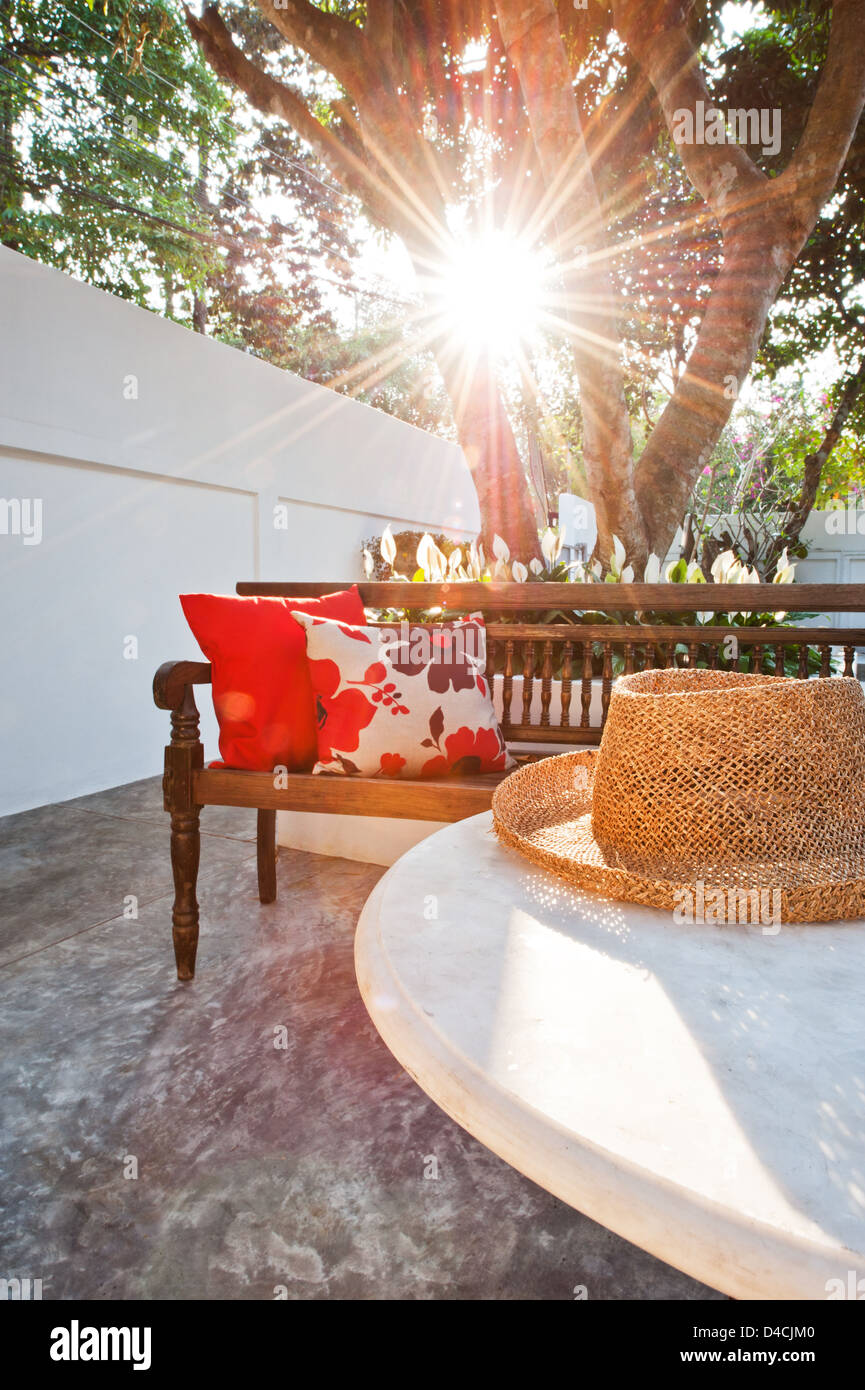 Outdoor patio seating are with nice bench at sunset Stock Photo - Alamy