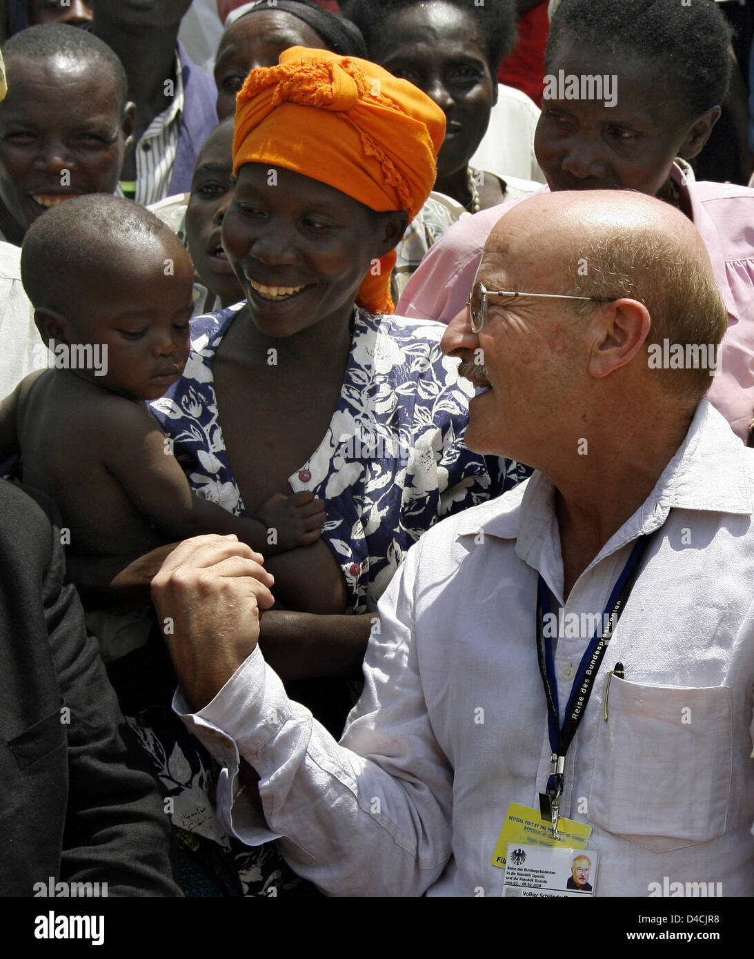 German director Volker Schloendorff (R) talks with children during the ...