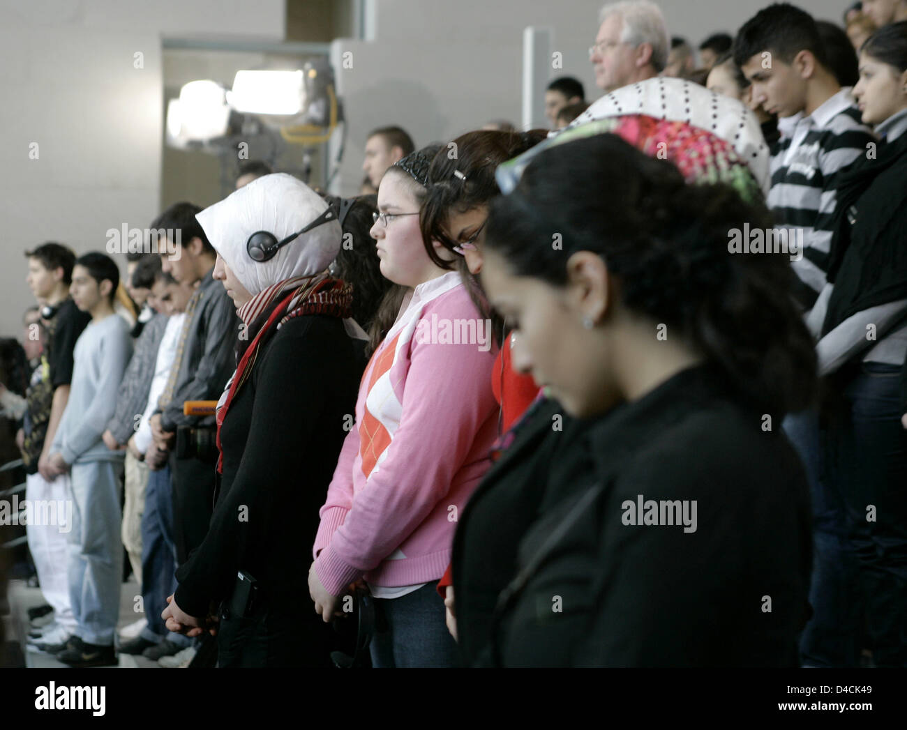 German school students stand in a minute of silence for the victims of ...