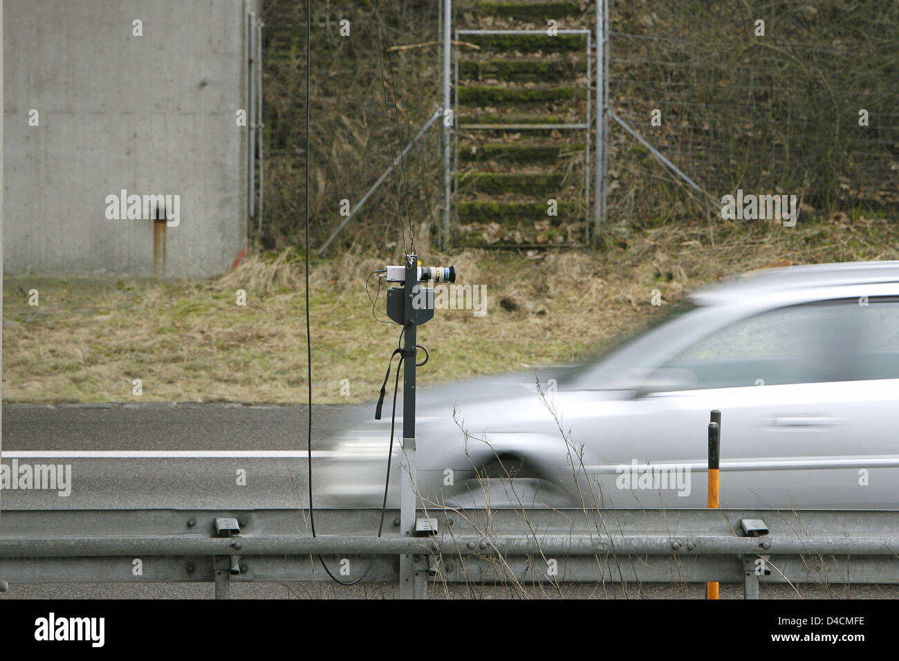 A video camera of the traffic control police measures the distance ...